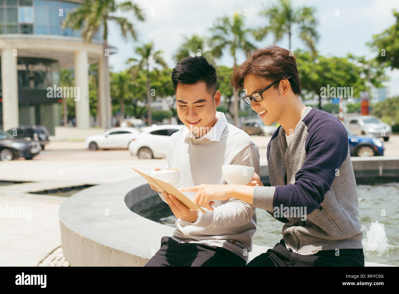 Asian men at work tablet hi-res stock photography and images - Alamy
