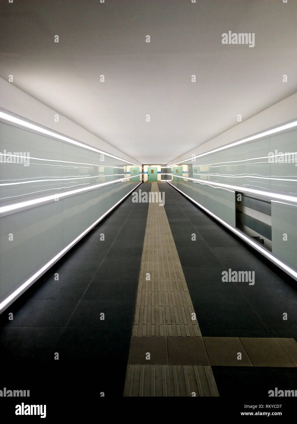 Modern pedastrians tunnel with linear white neon lights Stock Photo - Alamy