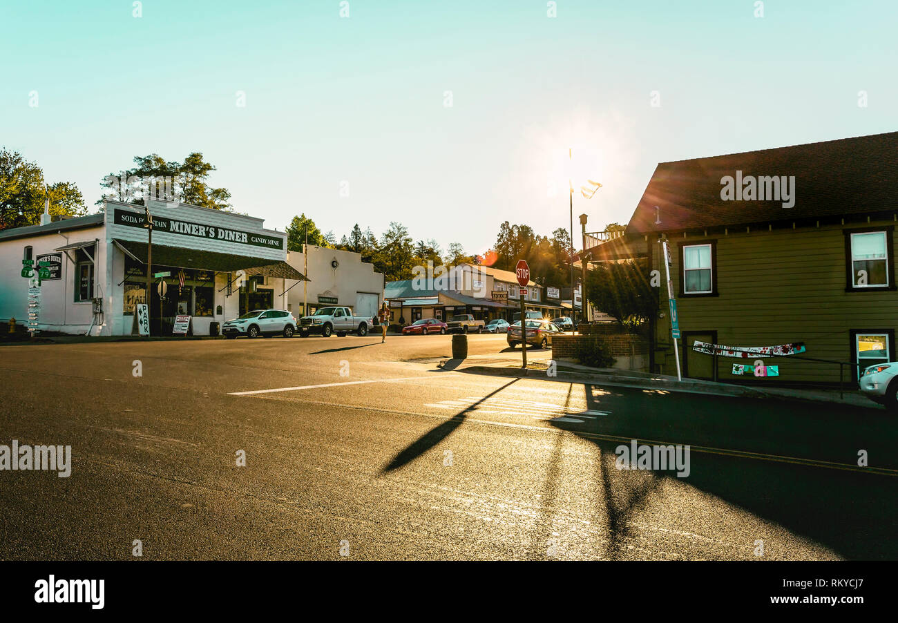 Pedestrian crosses the street in the historic small town of Julian in ...