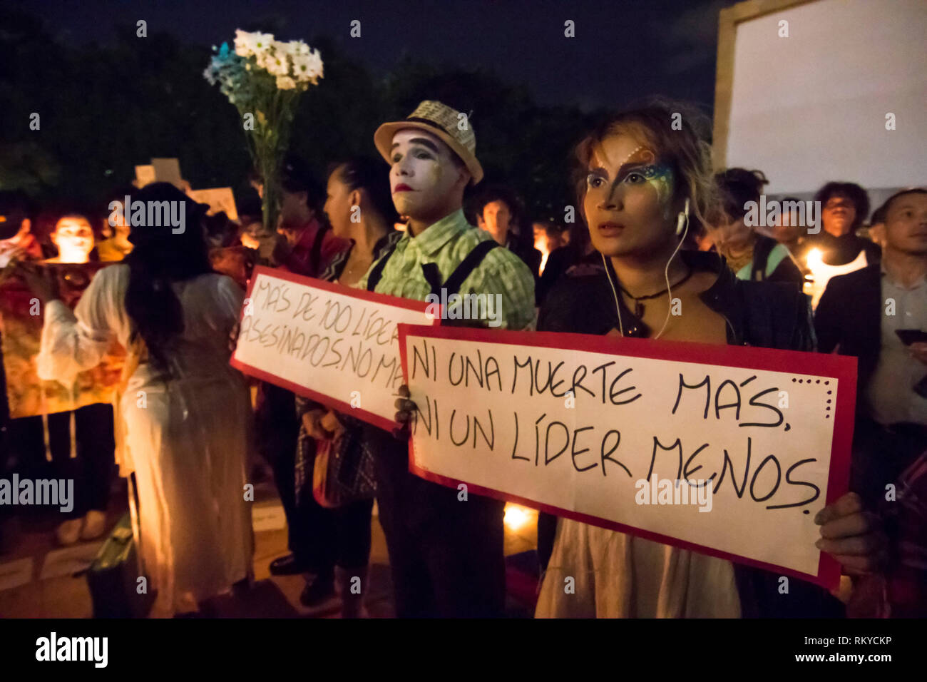 People holdin posters: "More than 100 leaders killed, no more" "Not one ...