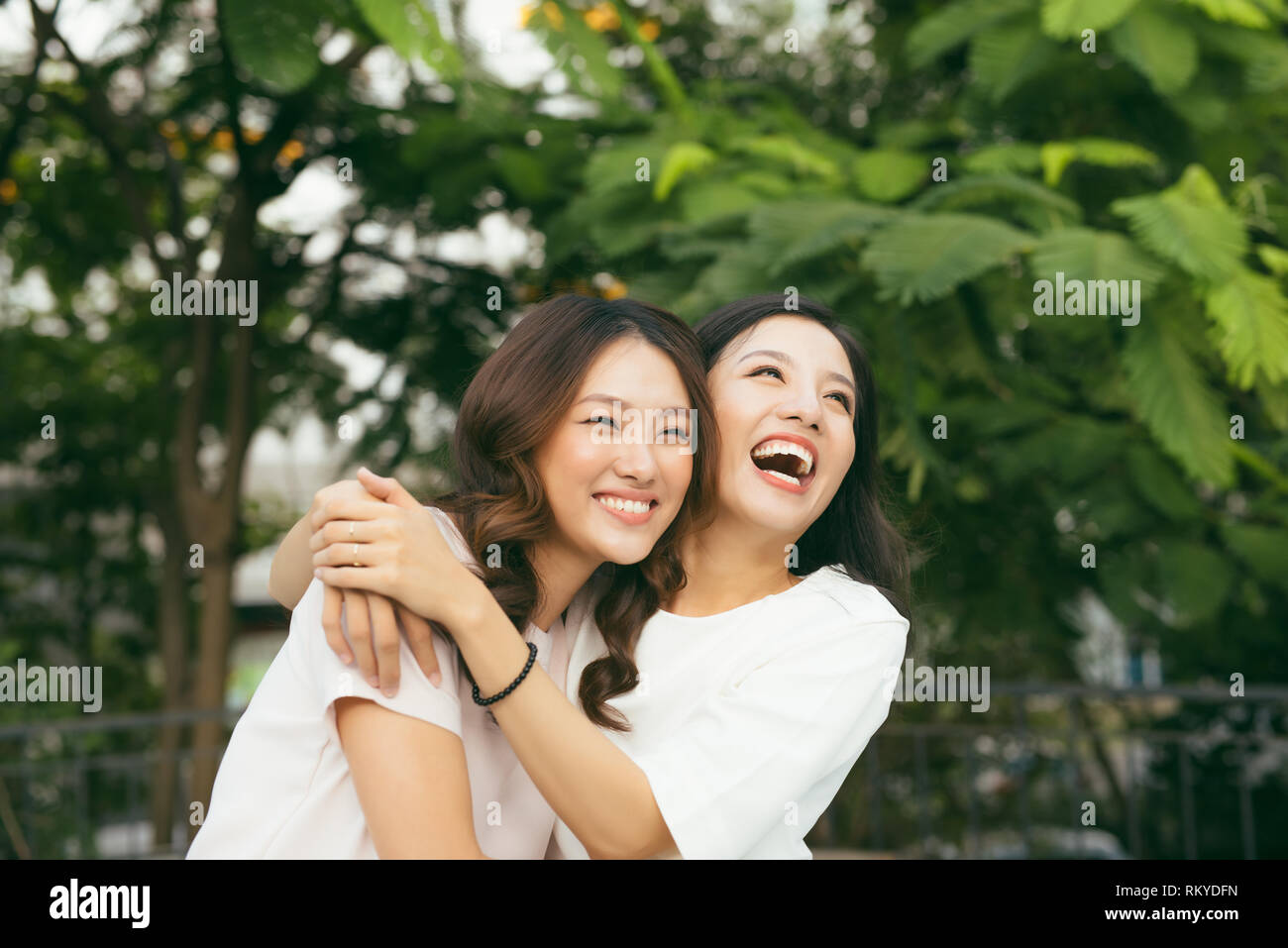 young pretty girlfriends over nature background, in the garden Stock ...