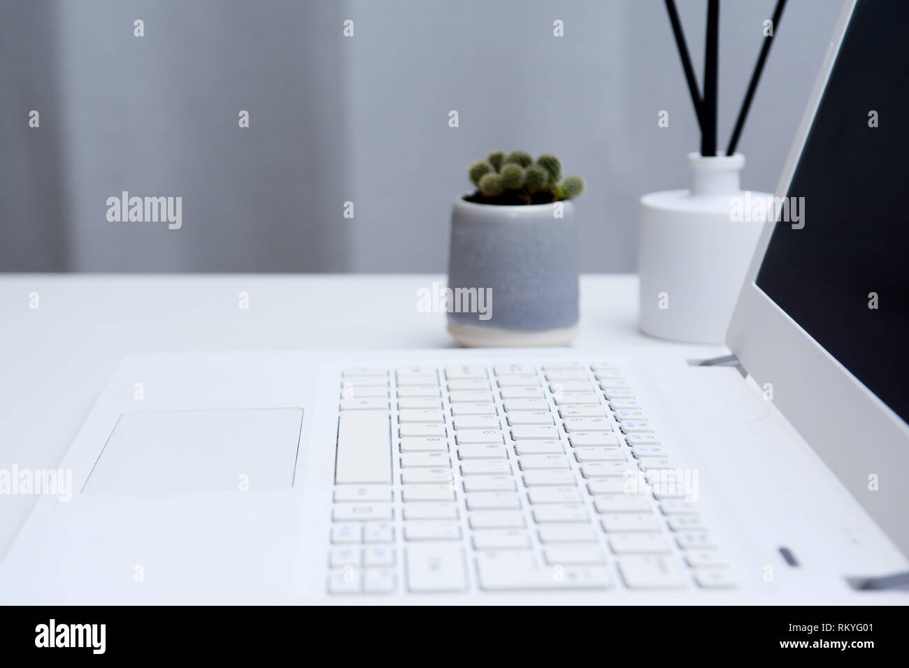 Laptop computer on modern office desk with blank screen Stock Photo - Alamy