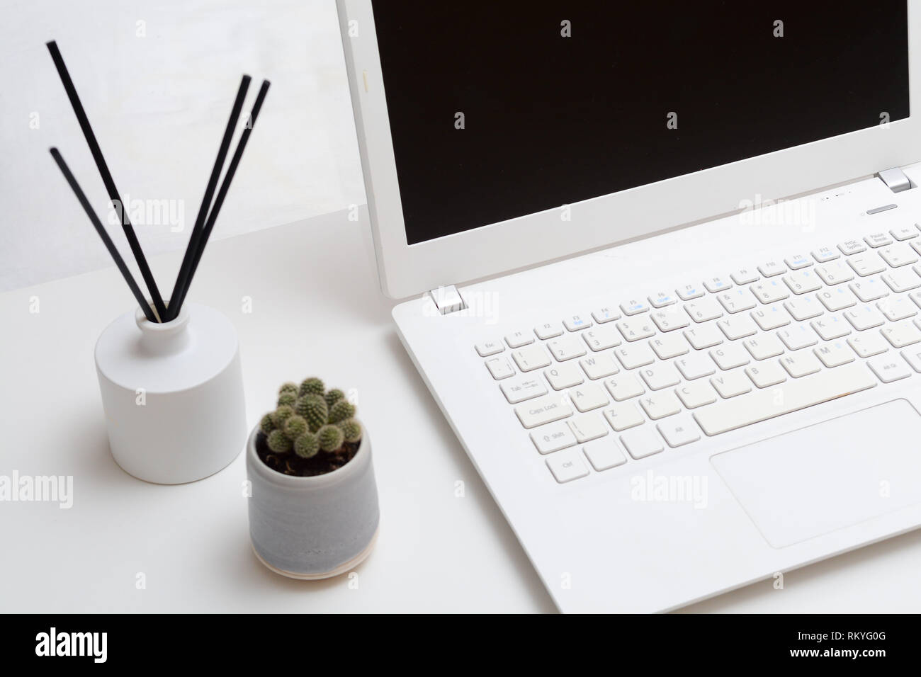 Laptop computer on modern office desk with blank screen Stock Photo - Alamy
