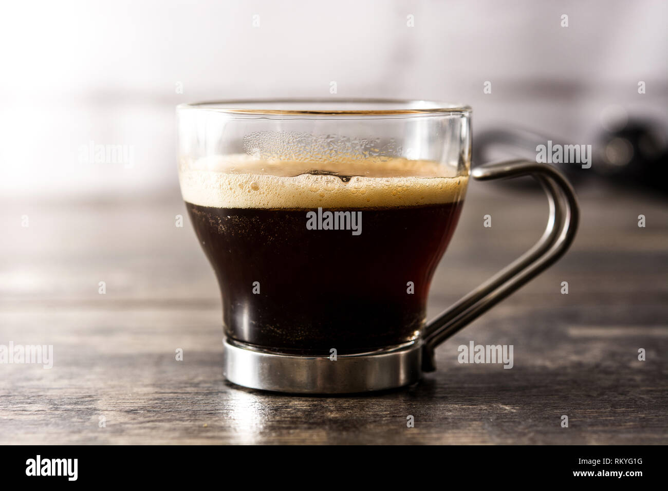 Hot coffee glass on wooden table Stock Photo - Alamy