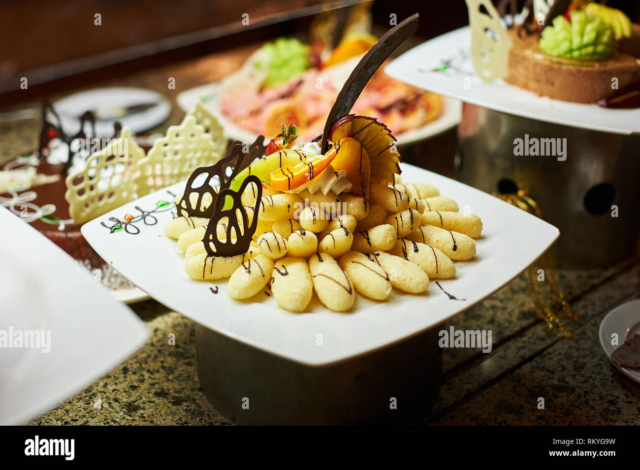 Rows of tasty looking desserts in beautiful arrangements. Sweets on ...