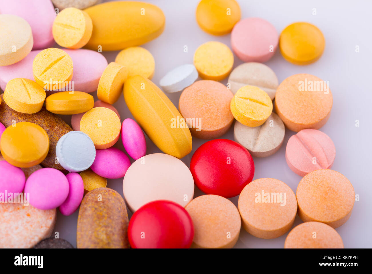 Tablets pills capsule heap mix therapy drugs, over a white background ...