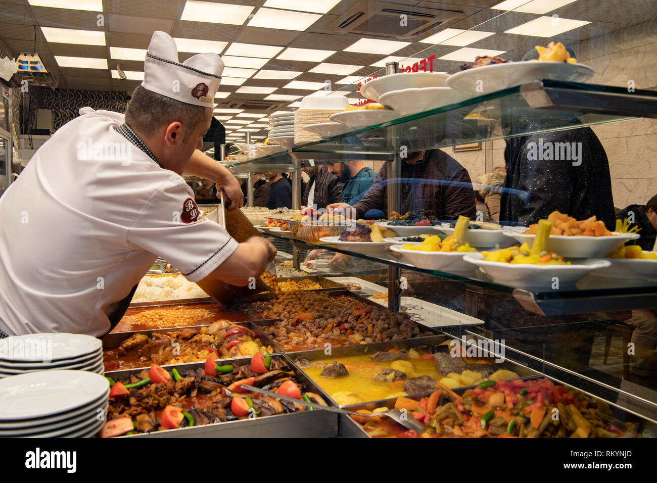 Men queue up for lunch in a Turkish self service restaurant Stock Photo ...