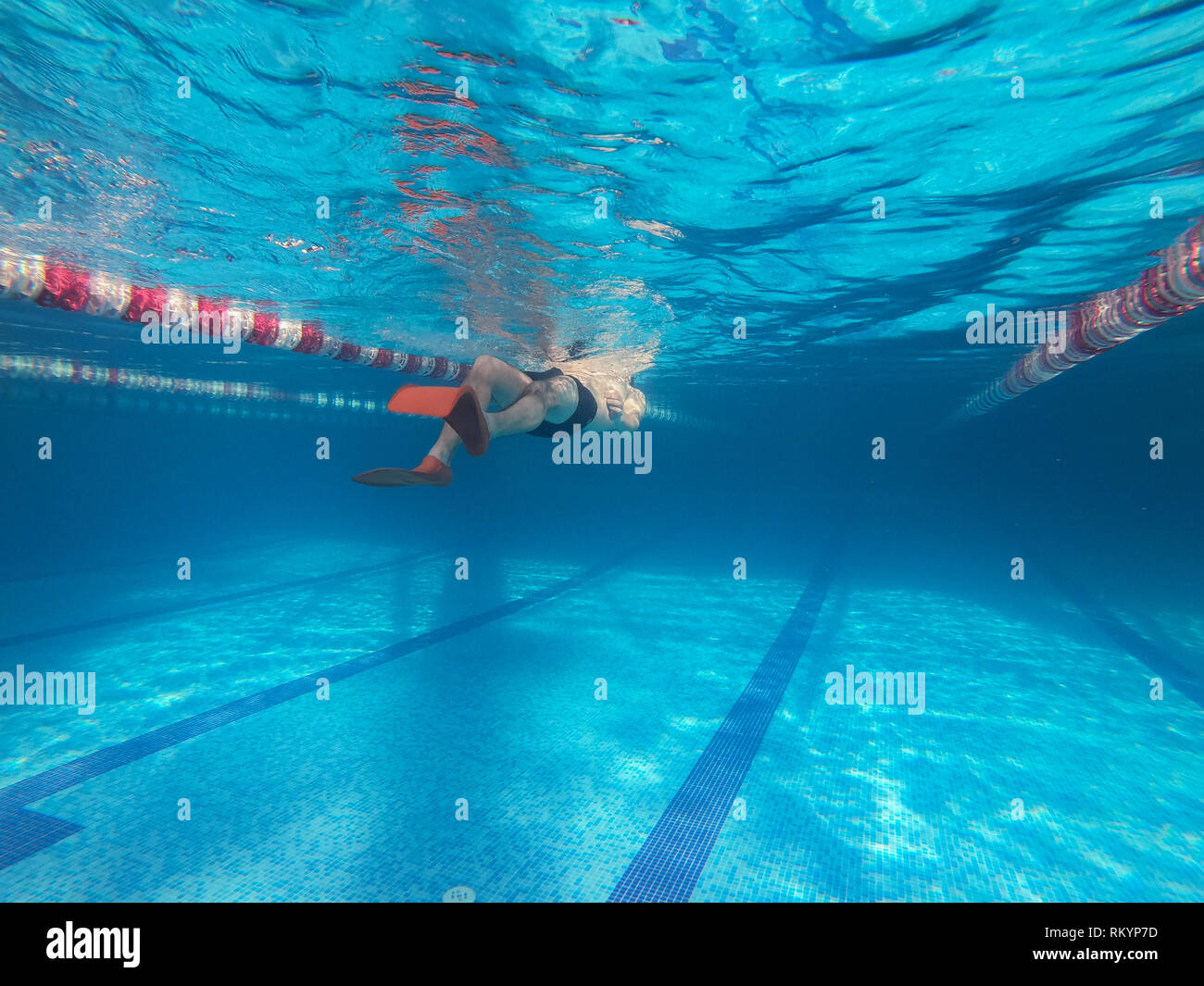 people swimming in pool view from the underwater. sporty lifestyle ...