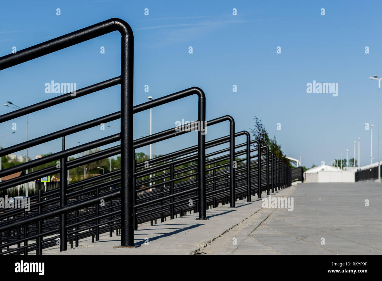 black metal railing for the fans queue on the way to the stadium Stock ...