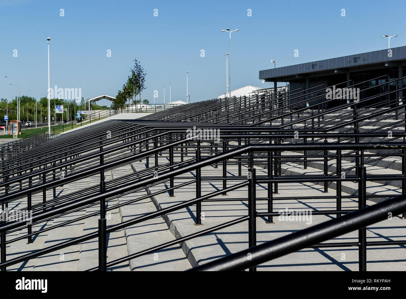 black metal railing for the fans queue on the way to the stadium Stock ...