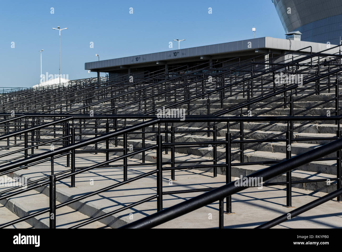 black metal railing for the fans queue on the way to the stadium Stock ...
