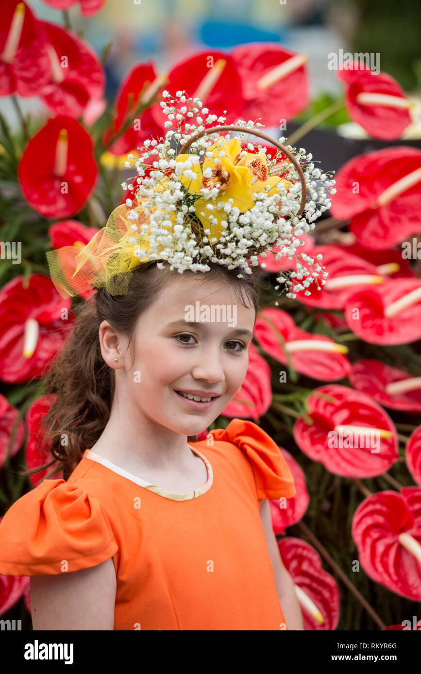 children dressed in colorful clothes at the Festa da Flor or Spring ...