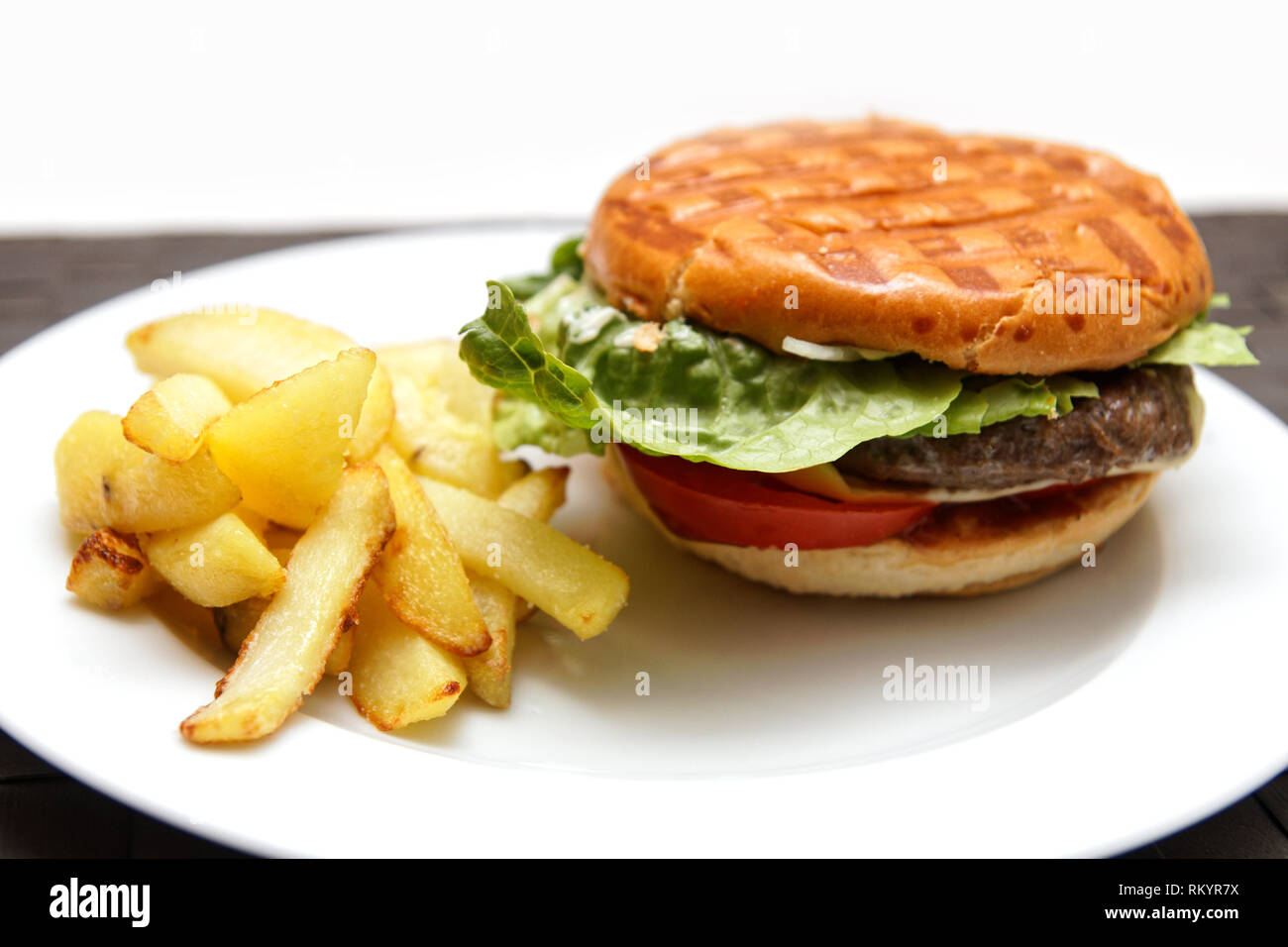 Cheeseburger with fries Stock Photo - Alamy