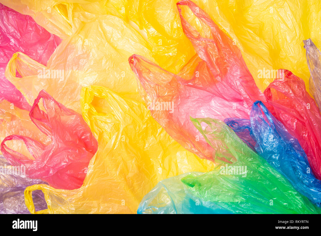 Multicolored single use plastic shopping bags background Stock Photo ...