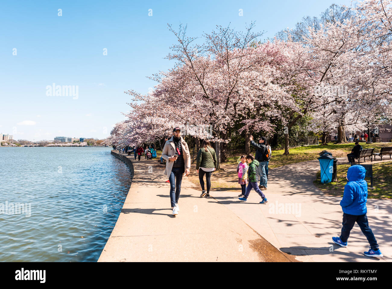 Washington DC, USA - April 5, 2018: Tourists people walking on sidewalk ...