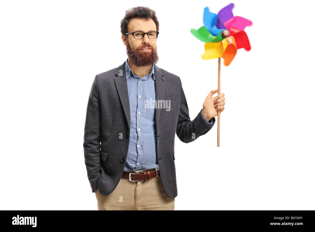 Bearded man holding a spinning pinwheel isolated on white background ...
