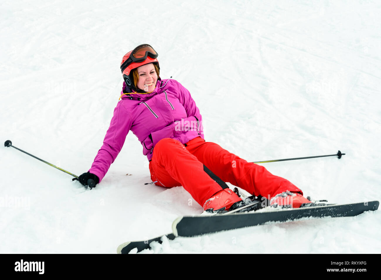 Female skier after falling down on a mountain slope Stock Photo - Alamy