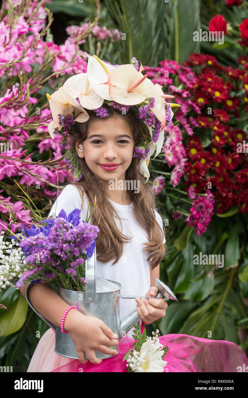 children dressed in colorful clothes at the Festa da Flor or Spring ...