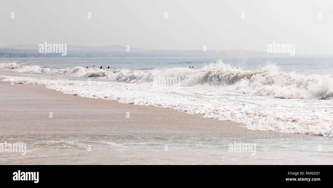 Powerful ocean waves at water front on a bright sunny day in Vietnam ...