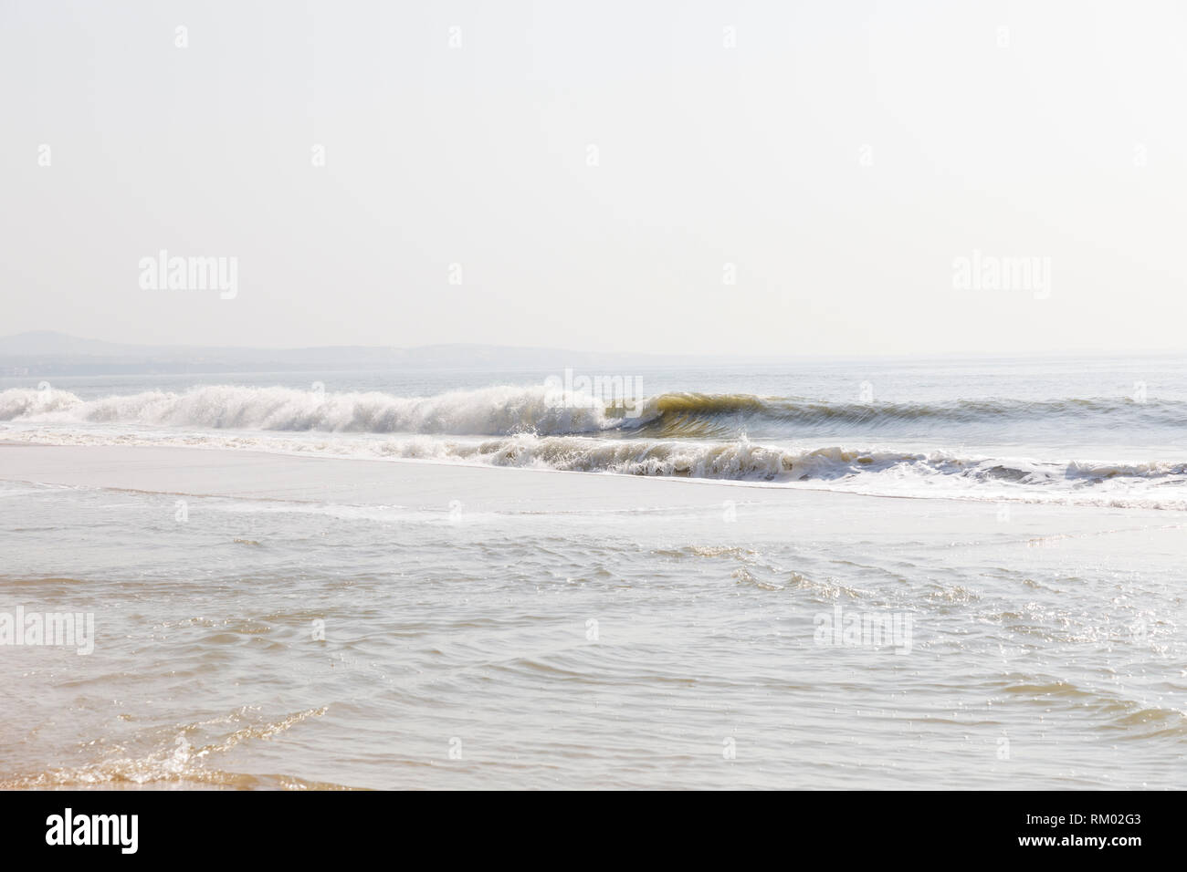 Powerful ocean waves at water front on a bright sunny day in Vietnam ...