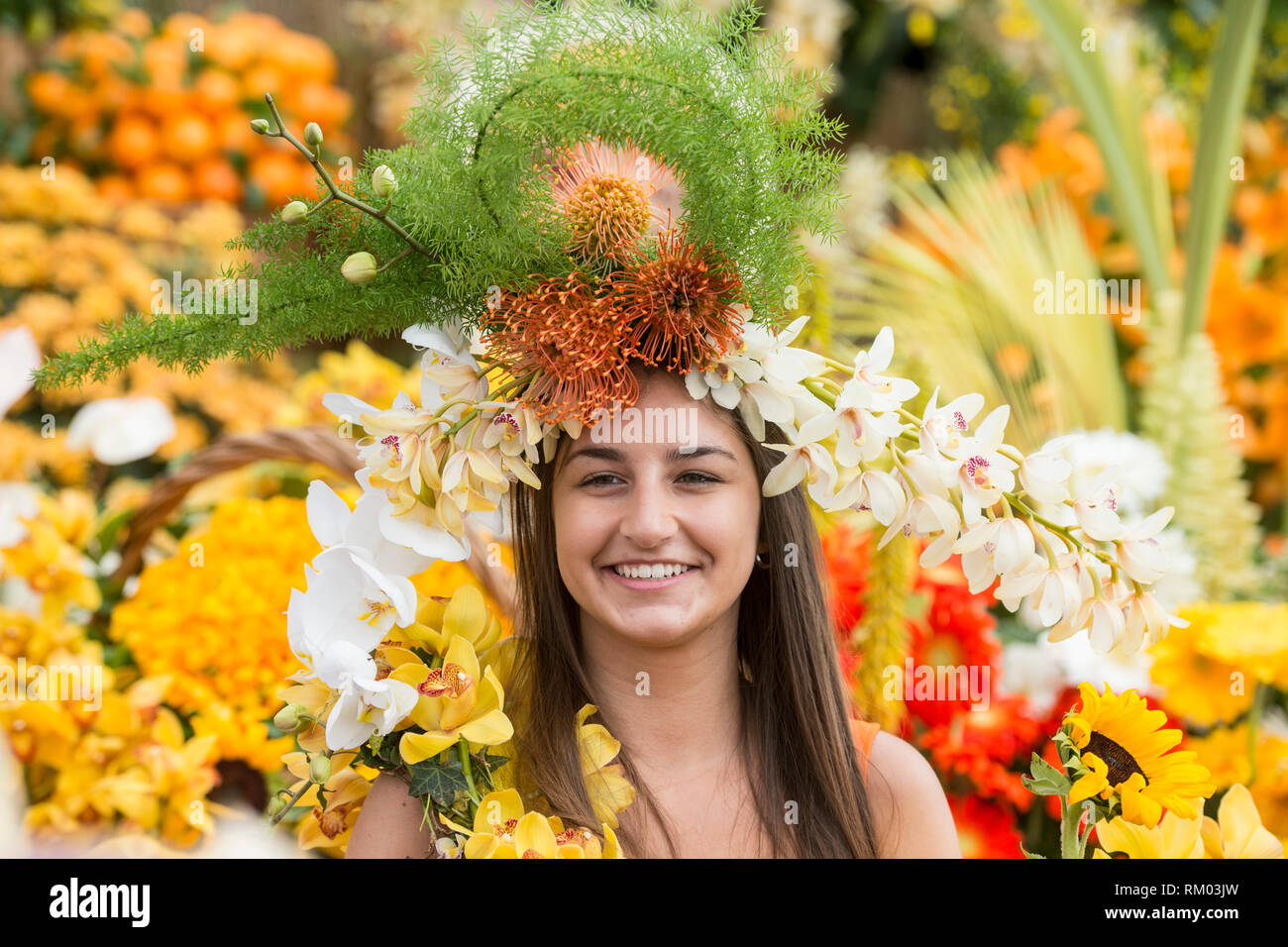 women dressed in colorful clothes at the Festa da Flor or Spring Flower ...