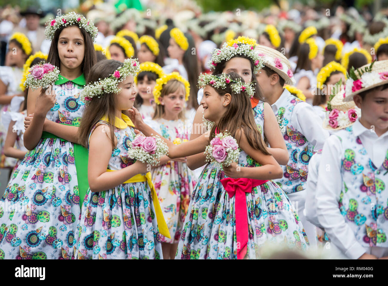 children dressed in colorful clothes at the Festa da Flor or Spring ...