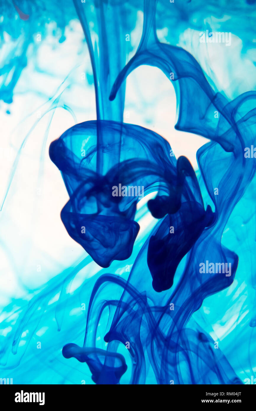 Blue ink dropped into water Stock Photo - Alamy
