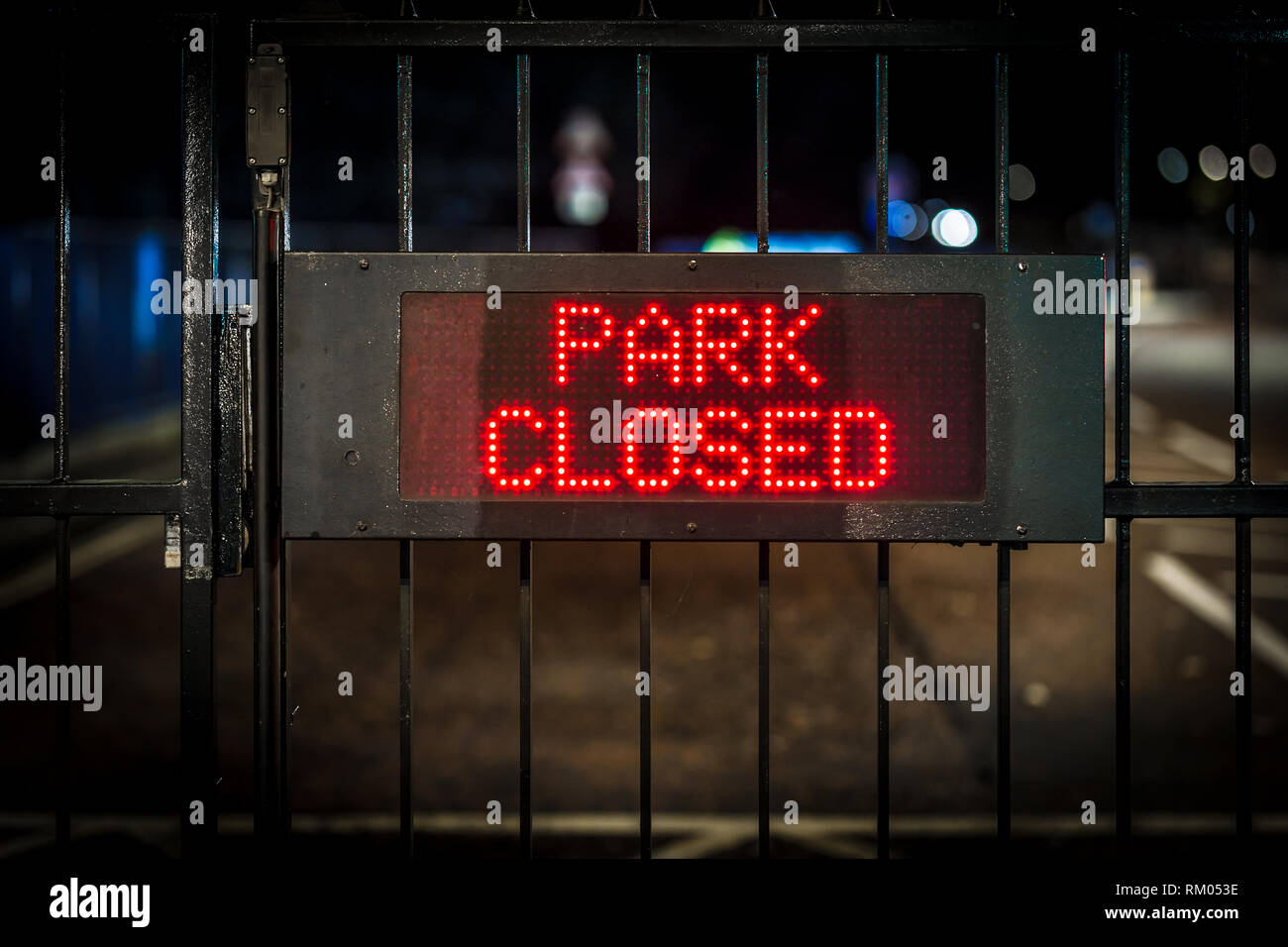 Night sign of park closure, London Stock Photo - Alamy