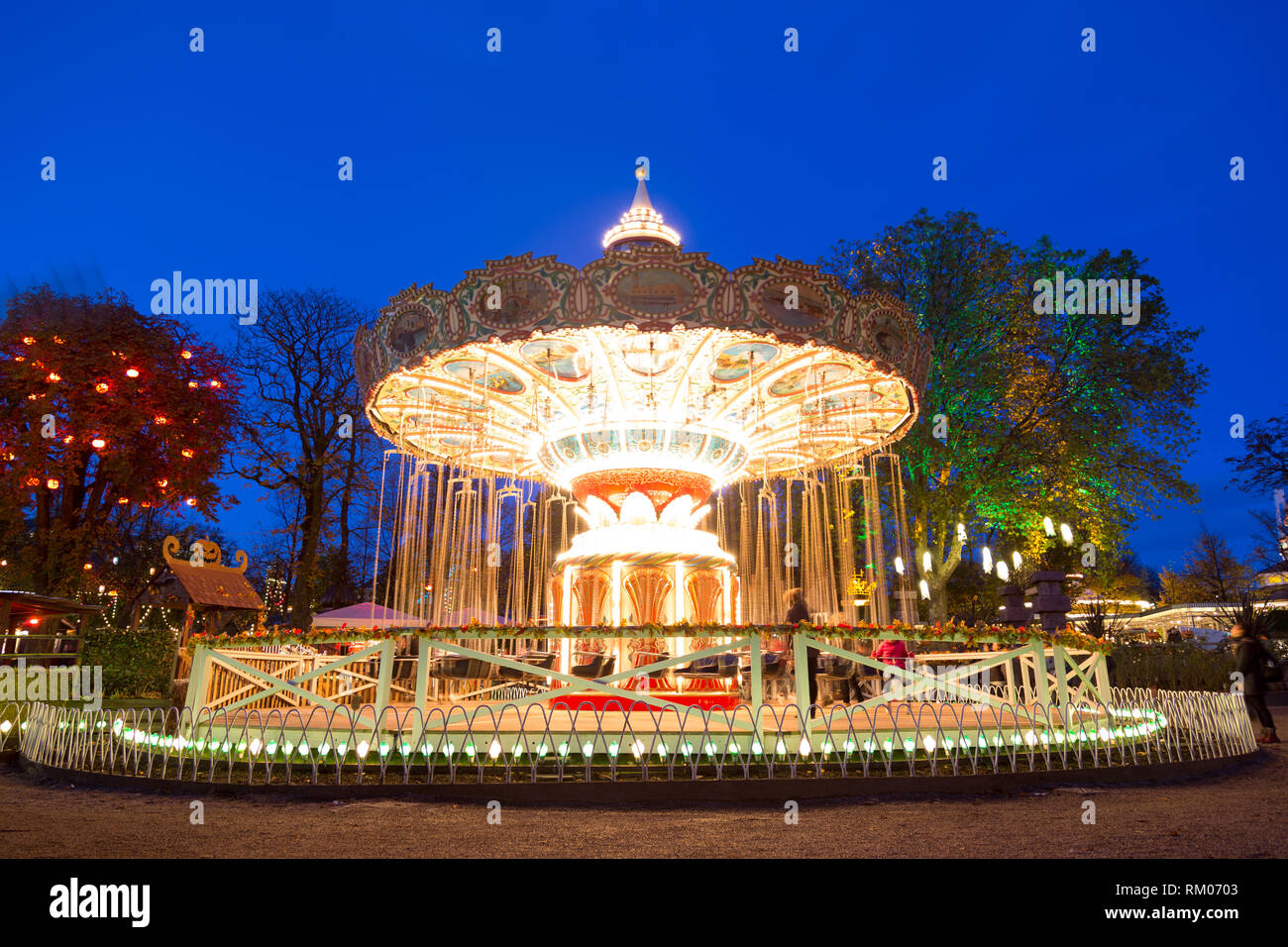 Illuminated carousel at Tivoli Gardens in Copenhagen Stock Photo - Alamy
