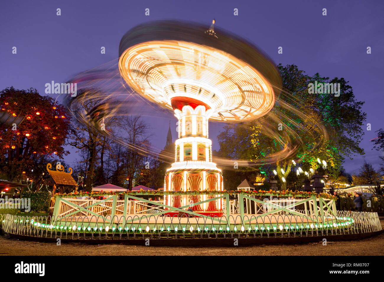 Illuminated carousel at Tivoli Gardens in Copenhagen Stock Photo - Alamy