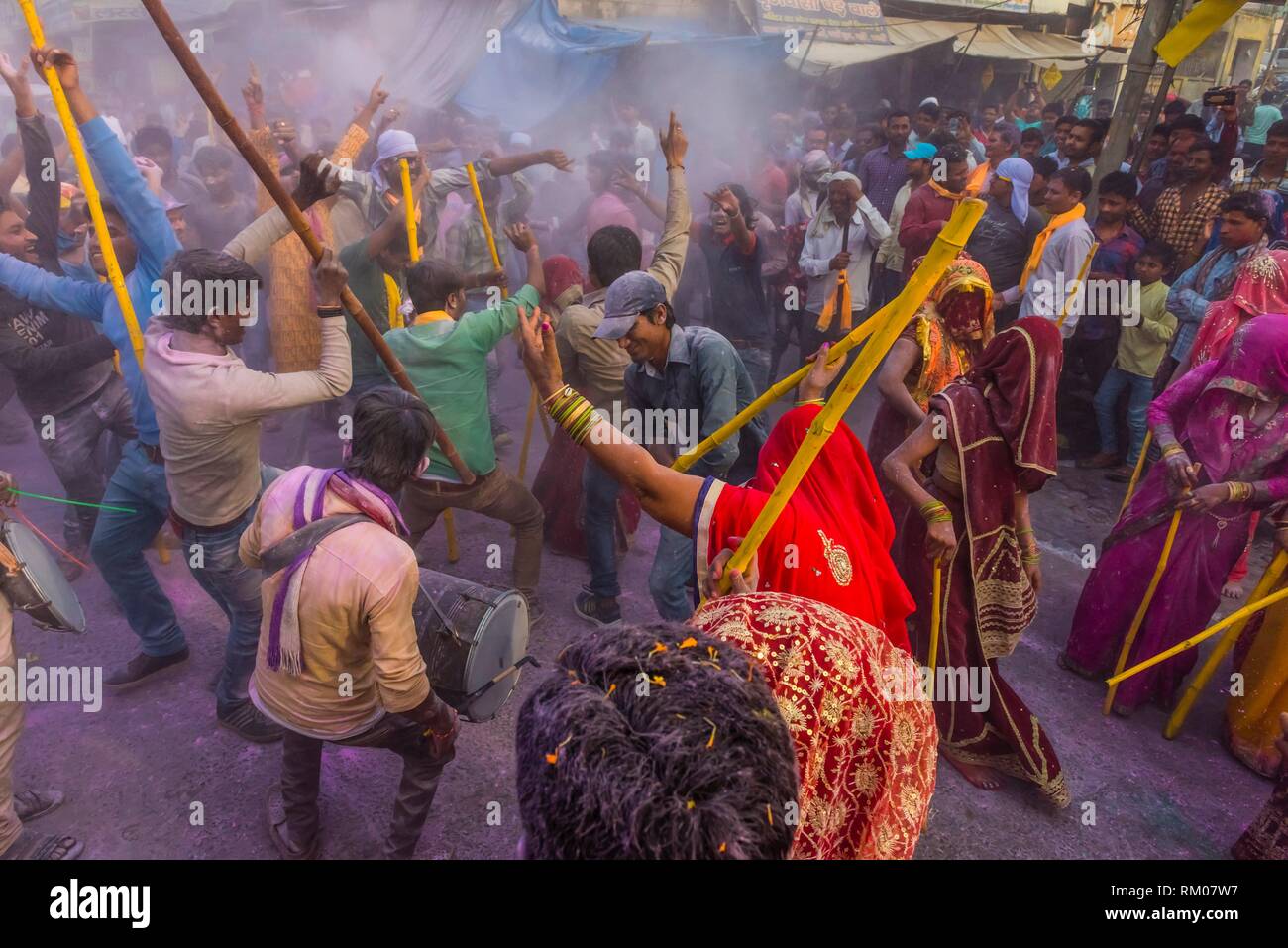 Indian Women Beating Man Stick High Resolution Stock Photography and ...