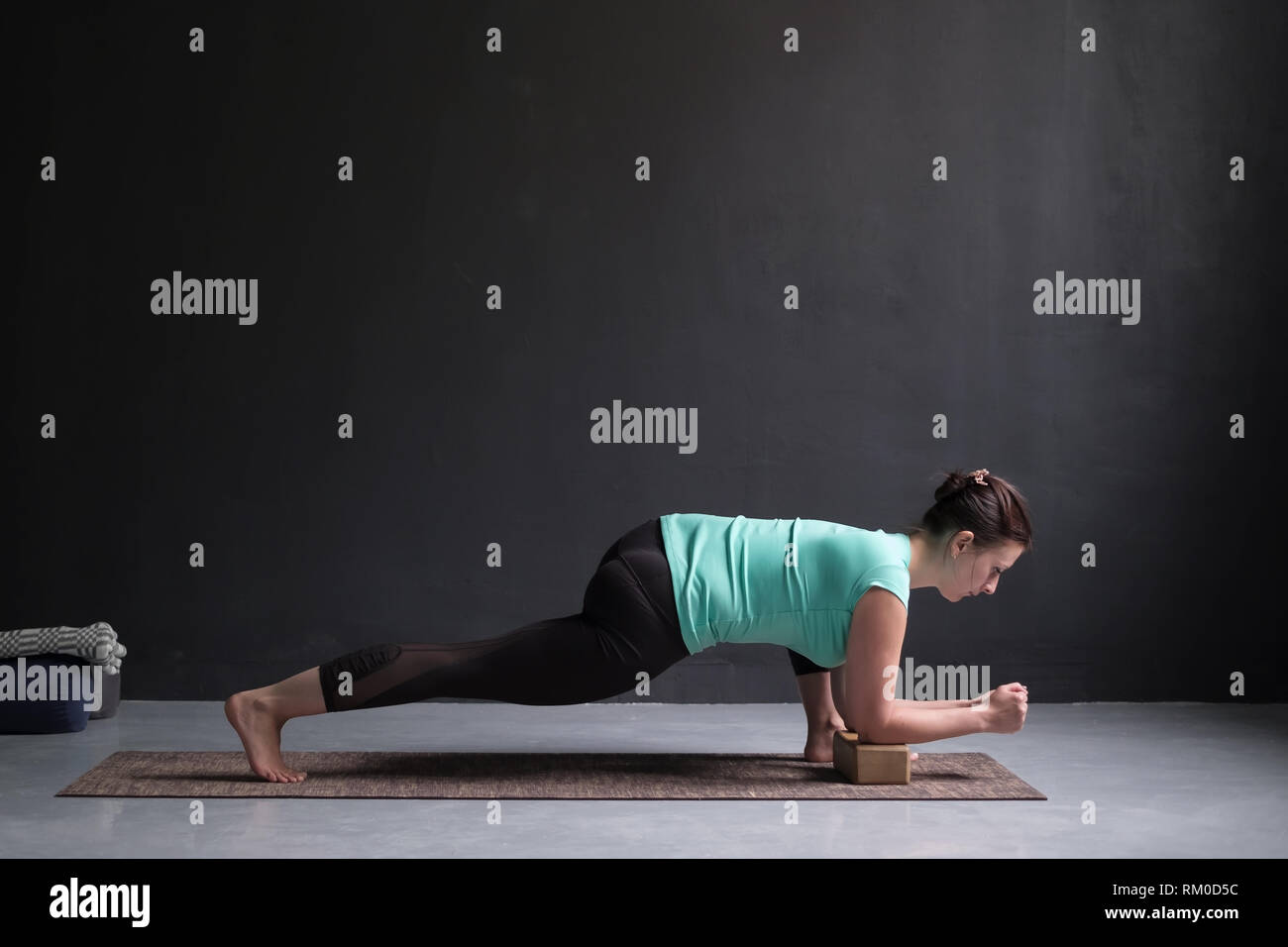 Young slim girl, doing horse rider exercise, anjaneyasana pose, working ...
