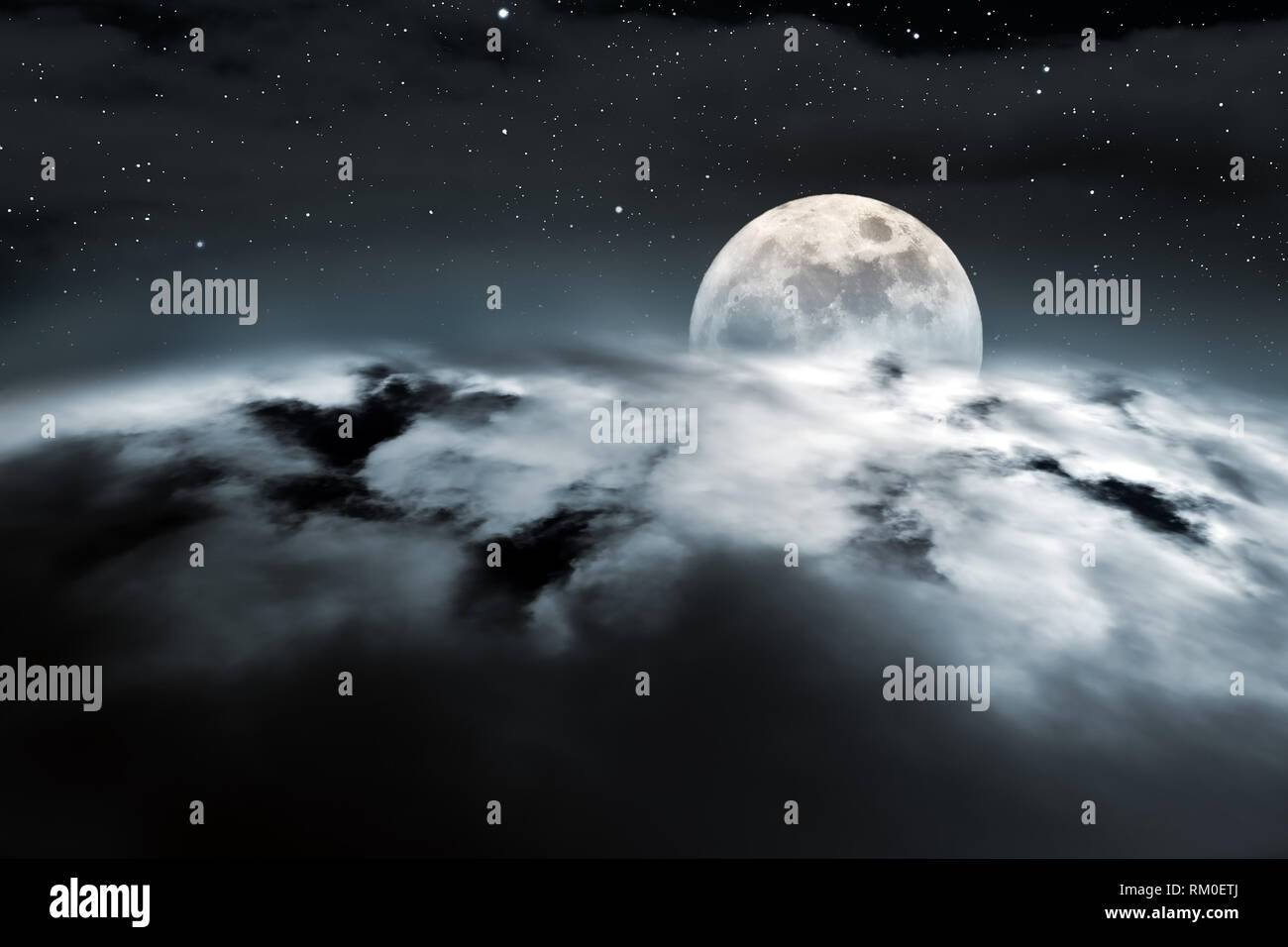 The moon rises over a region covered with clouds Stock Photo - Alamy