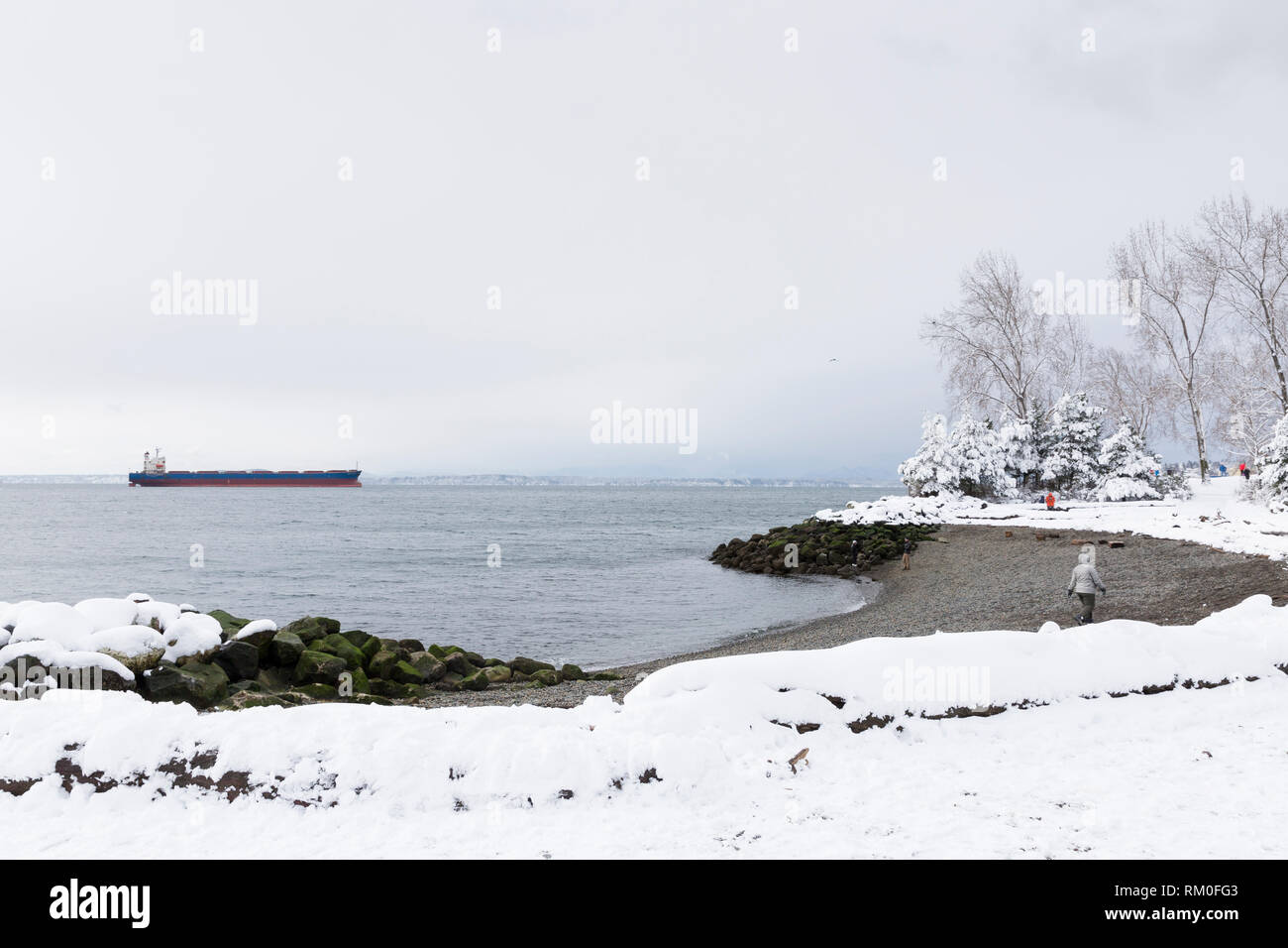 Seattle, Washington: Visitors enjoy the beach in Myrtle Edwards Park as ...
