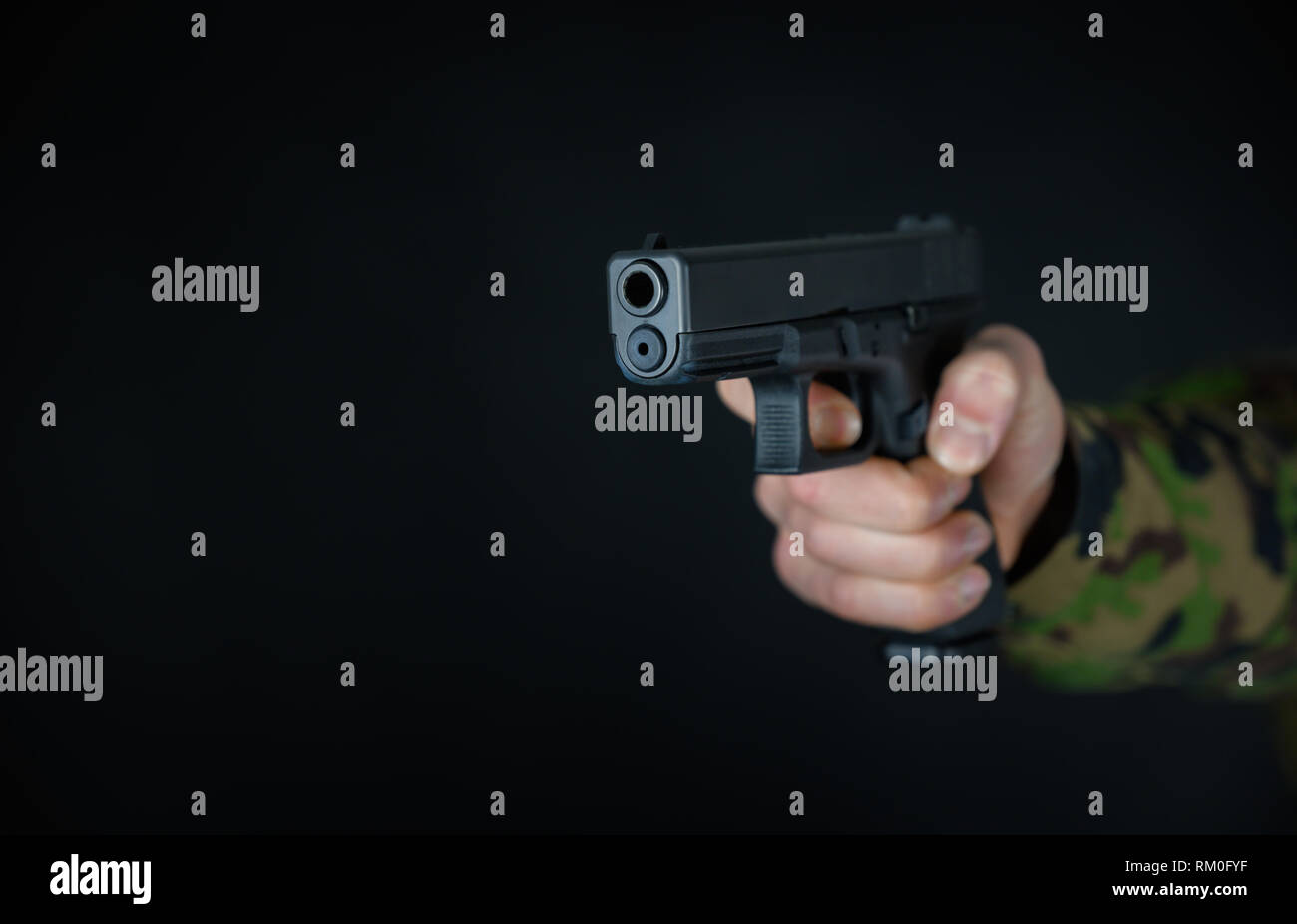 Holds gun hi-res stock photography and images - Alamy