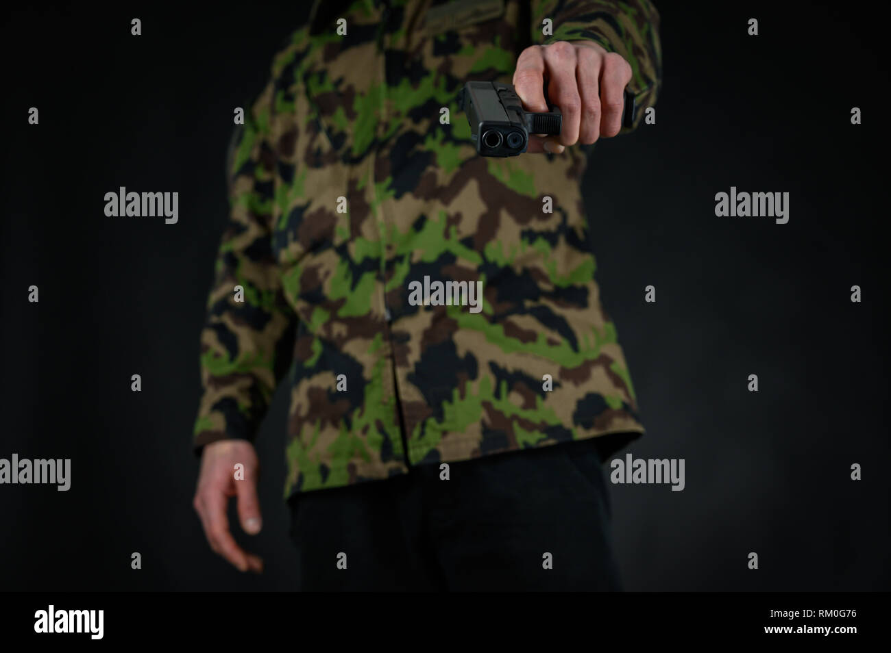 Soldier hold his gun Stock Photo - Alamy