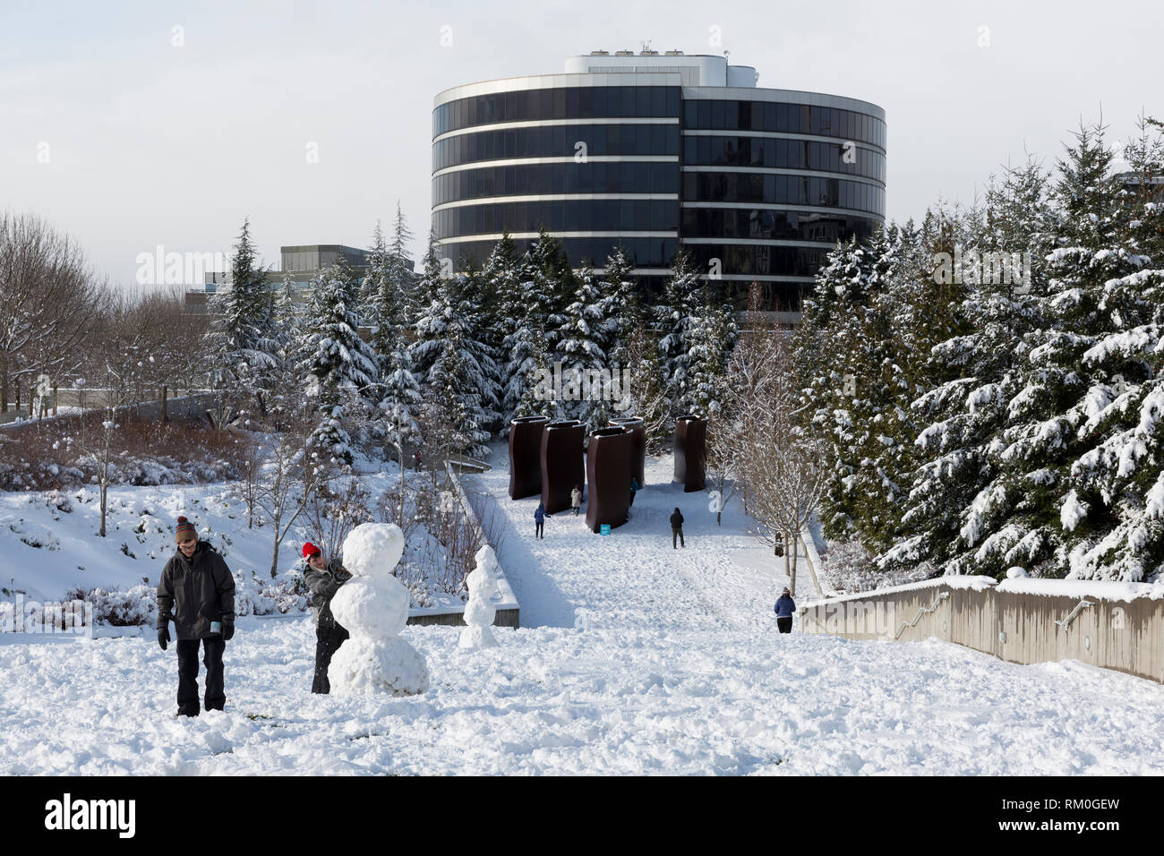 Seattle, Washington: Two fiends build a snowman in Olympic Sculpture ...