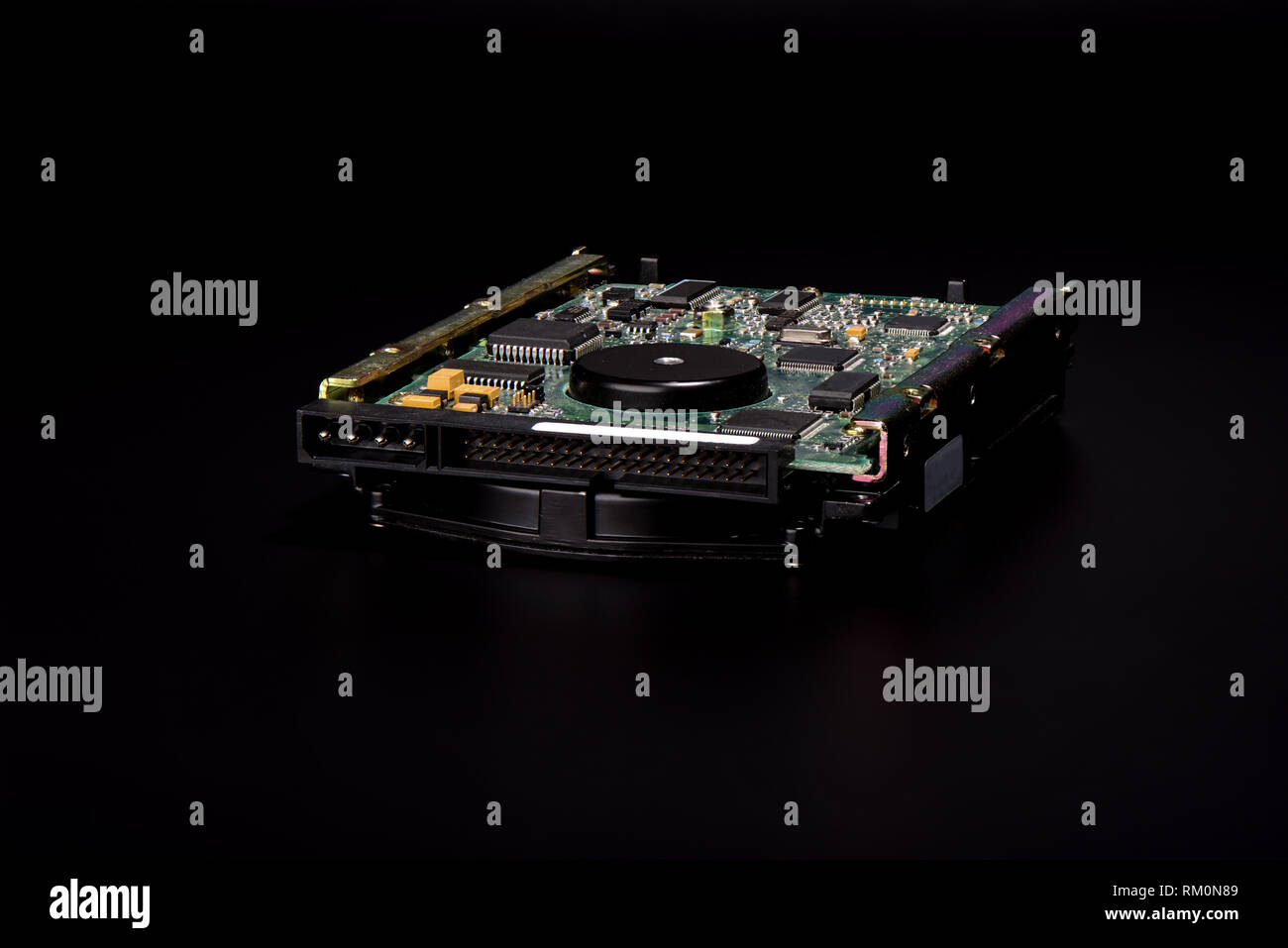 Used hard disk isolated on black background. Dusty old hdd Stock Photo ...