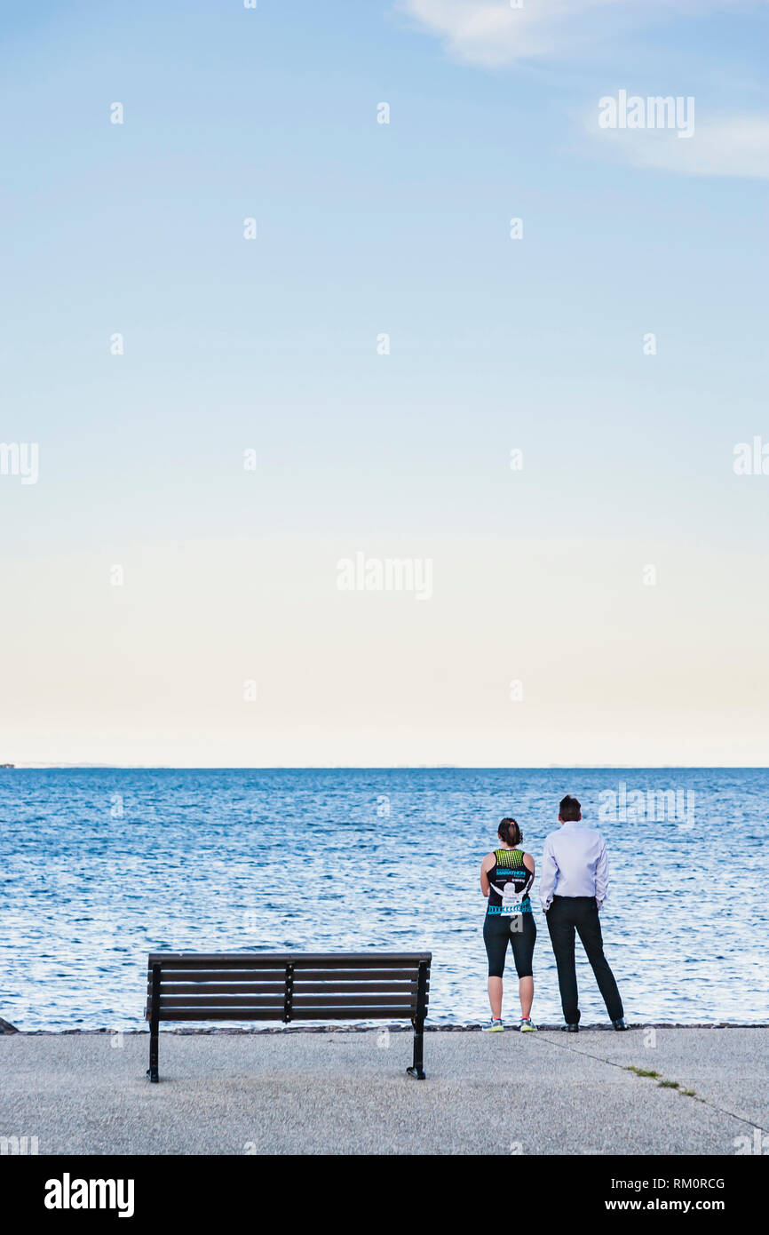 Two people enjoying the ocean view Stock Photo - Alamy