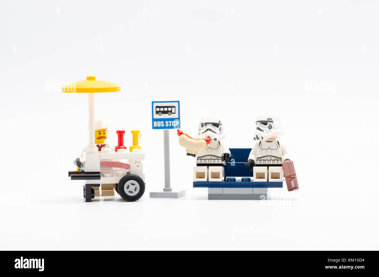 Storm troopers at bus stop with Hot dog stand. Lego minifigures are ...