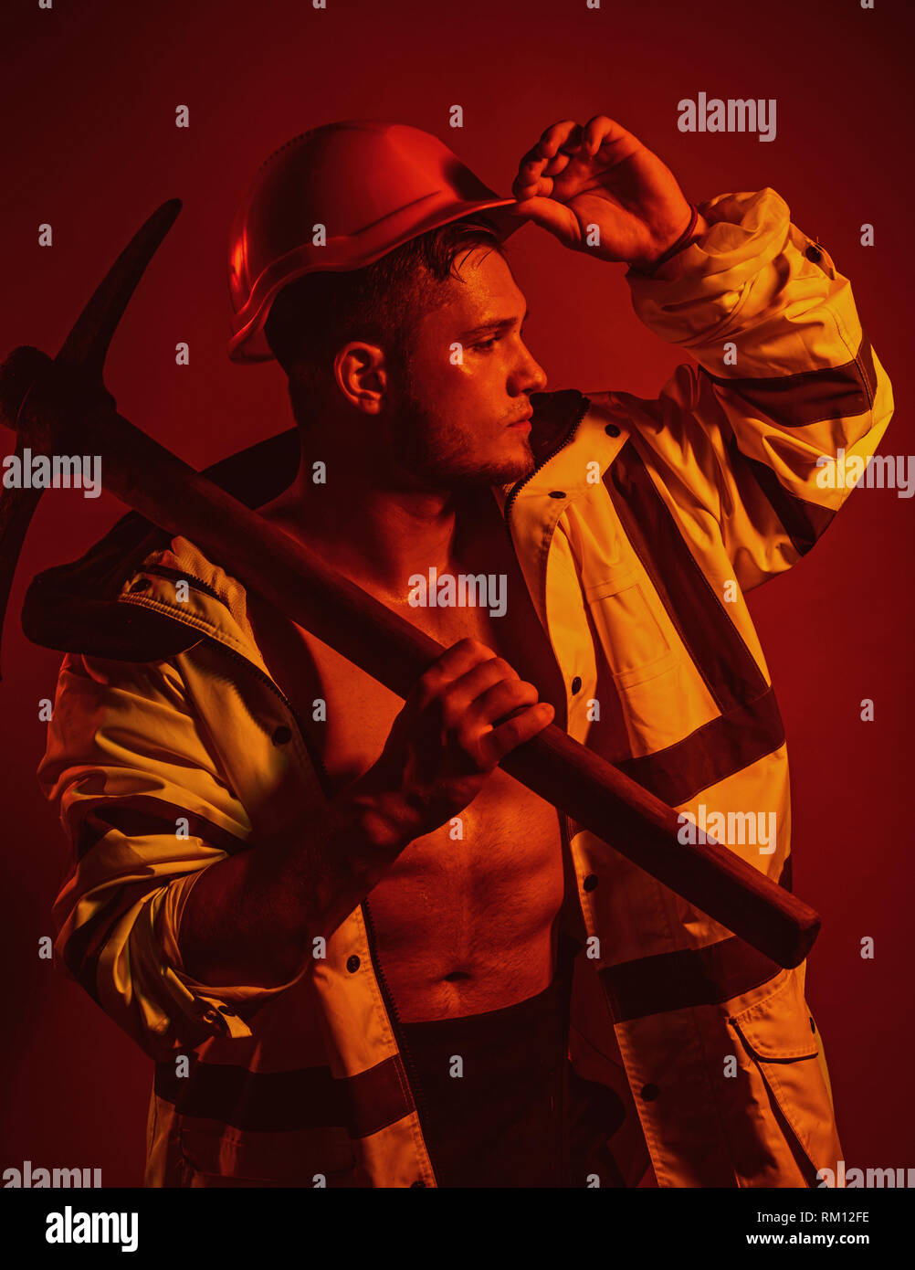 Mining area under construction. Hard worker with muscular torso ...