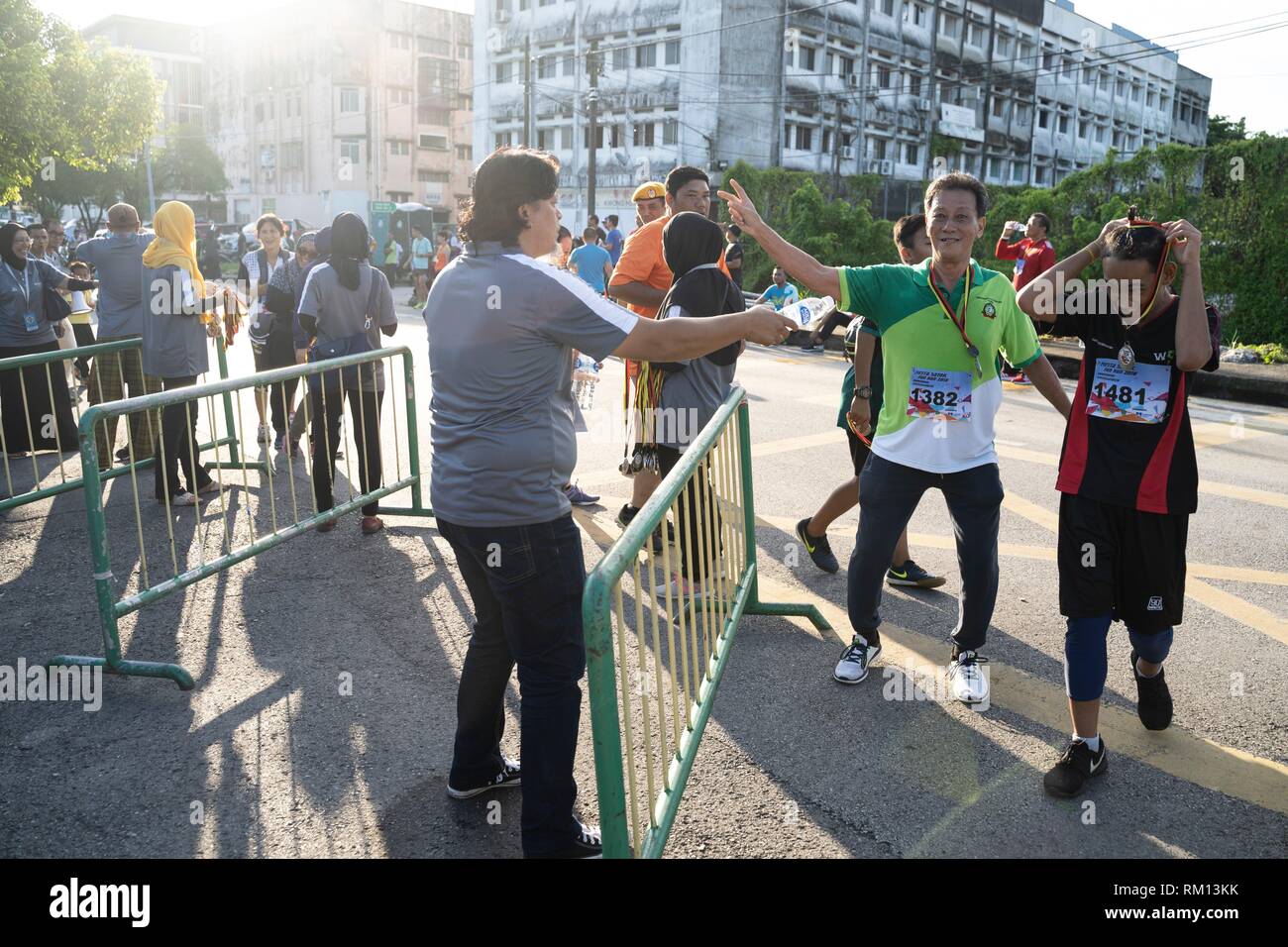 Happy runners at the finish line of the Kuching City North fun run at ...