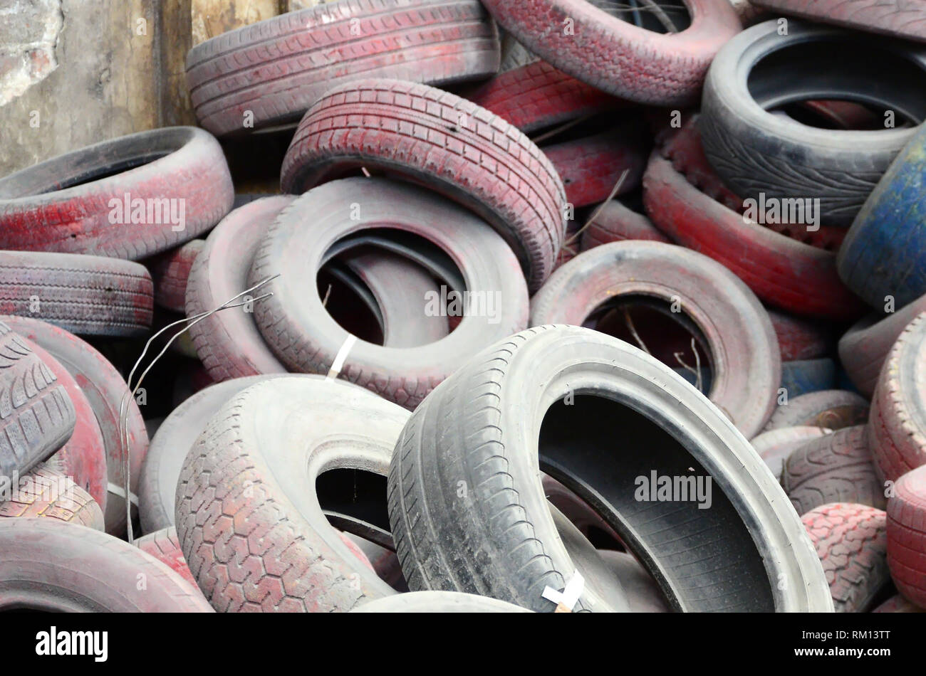 A picture of many old used tires left on a waste dump. The picture of ...