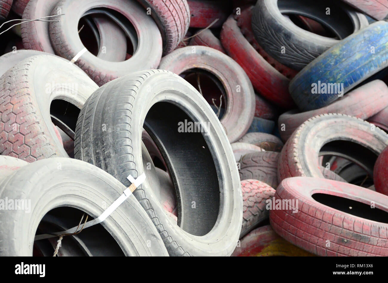 A picture of many old used tires left on a waste dump. The picture of ...