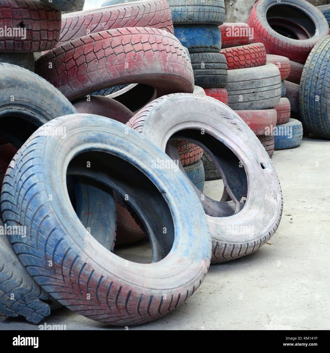 A picture of many old used tires left on a waste dump. The picture of ...