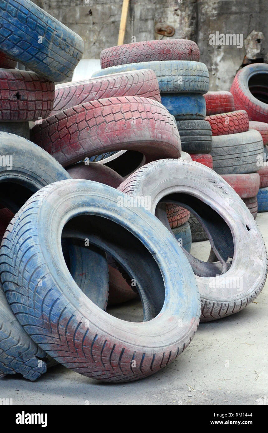 A picture of many old used tires left on a waste dump. The picture of ...