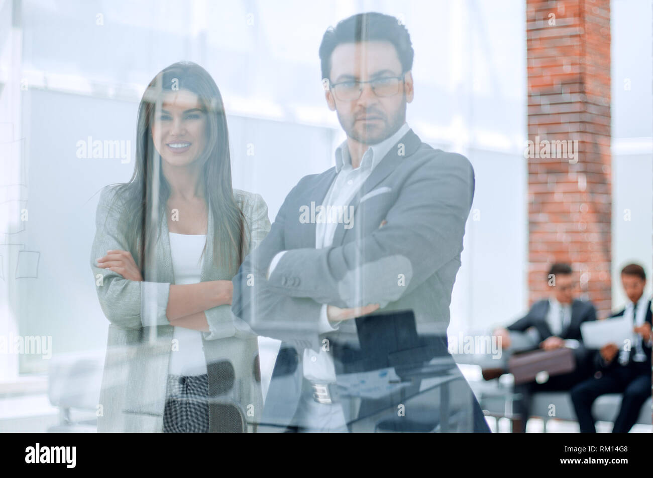 business partners standing in a modern office Stock Photo - Alamy