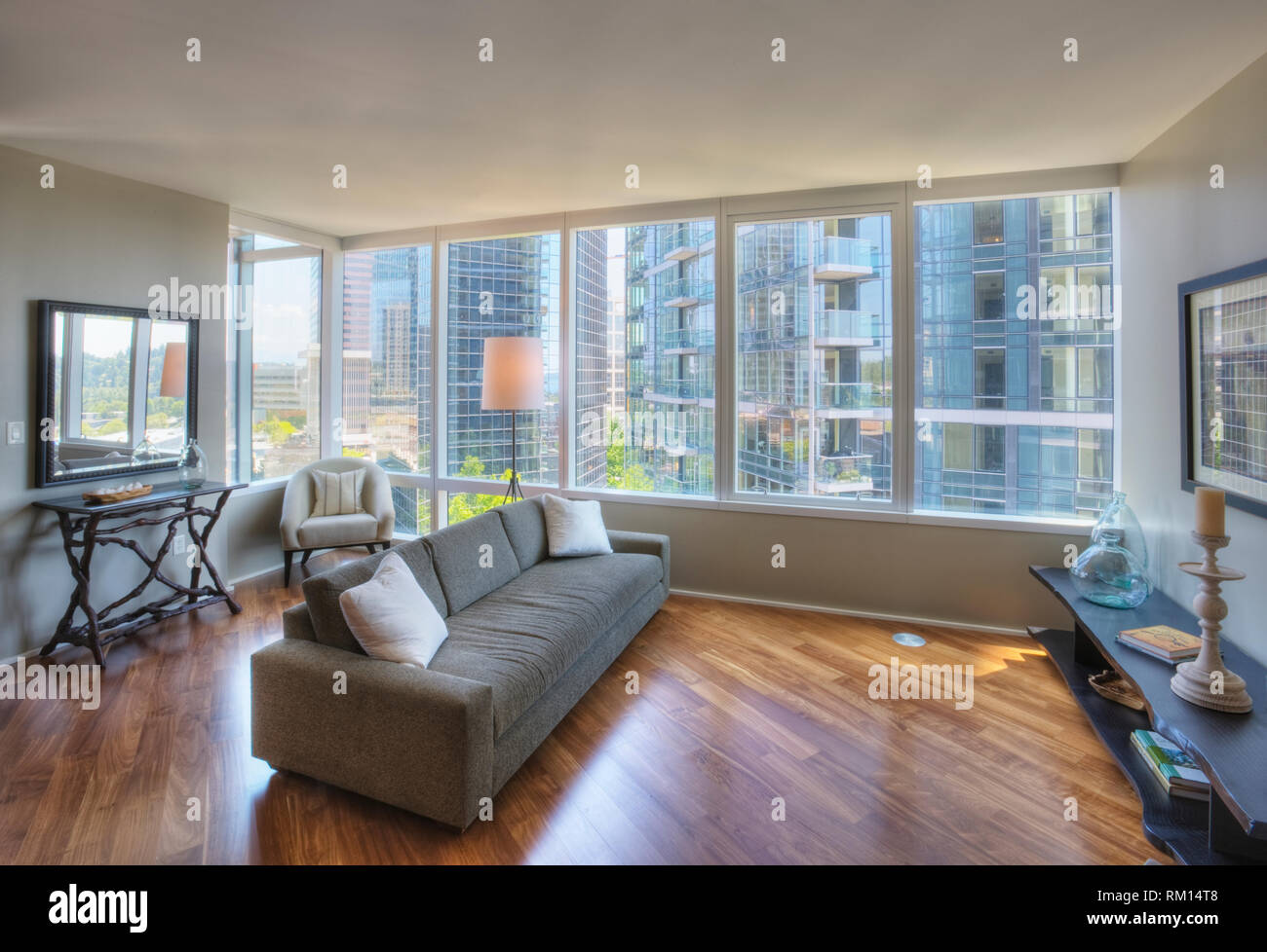 Living room in highrise apartment Stock Photo - Alamy
