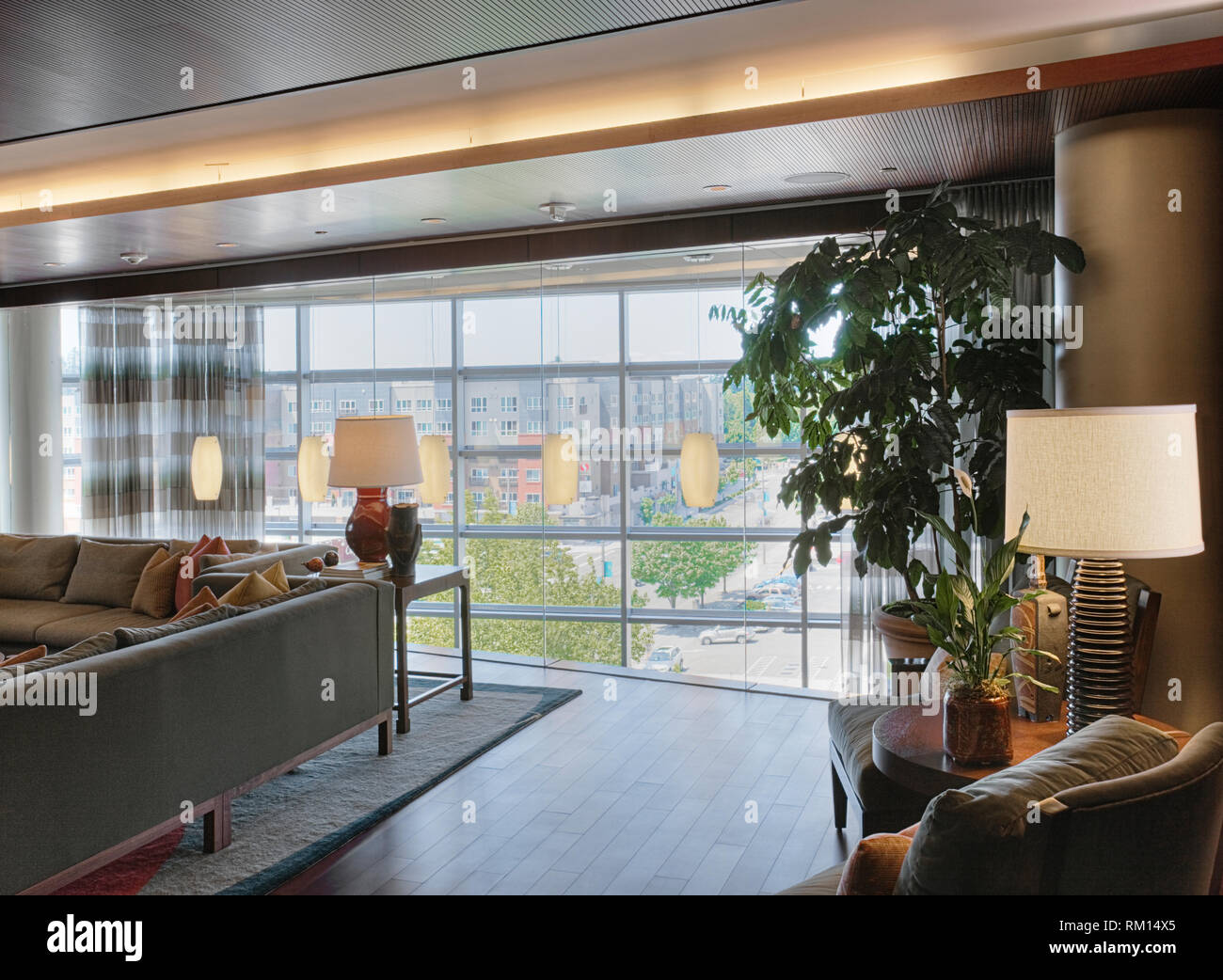 Living room in luxury highrise apartment Stock Photo - Alamy