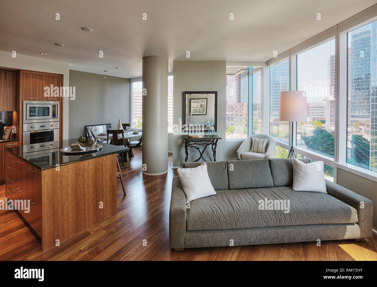 Open floor plan in luxury highrise apartment Stock Photo - Alamy